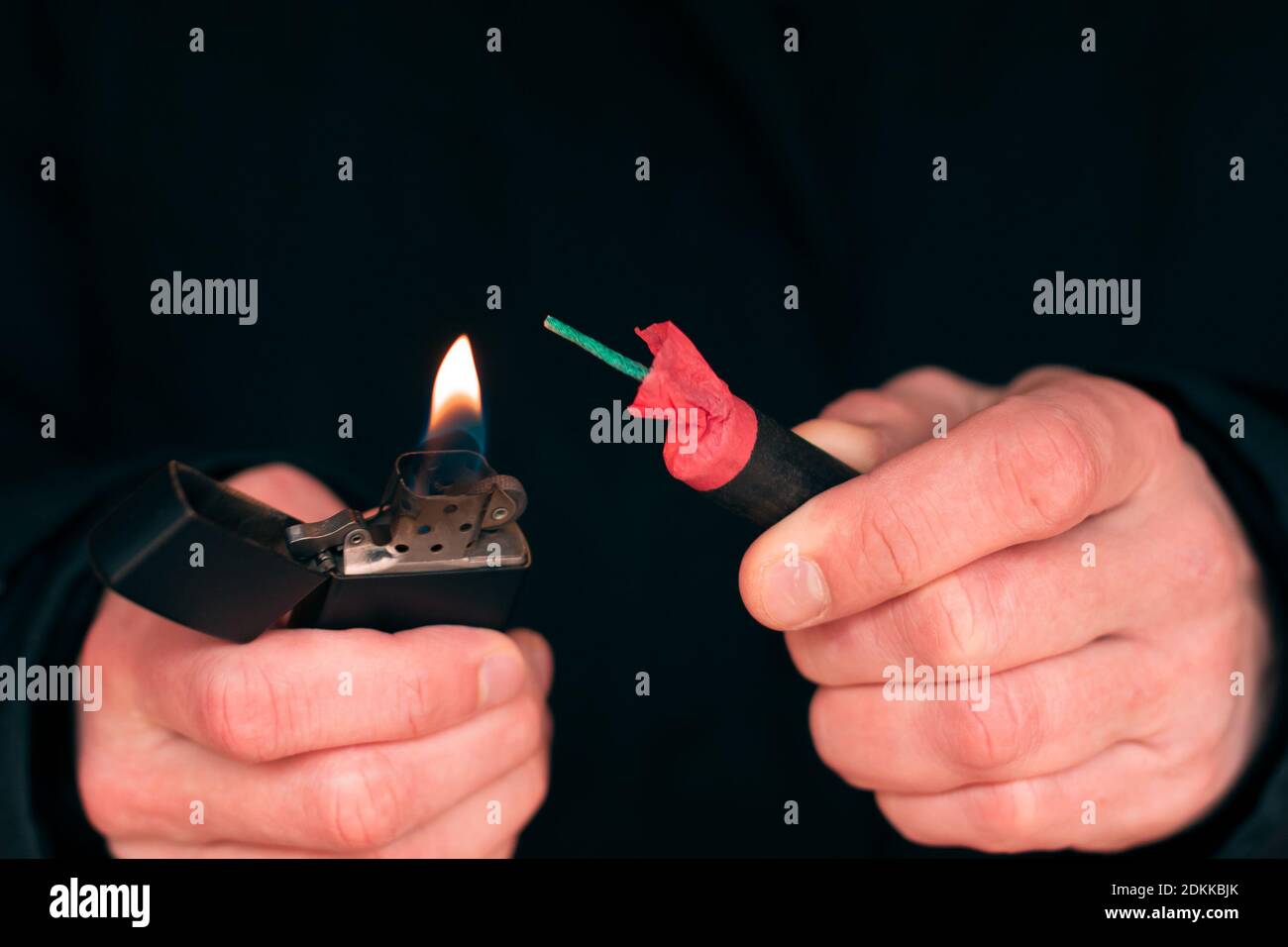 Man lighting a firework hi-res stock photography and images - Alamy