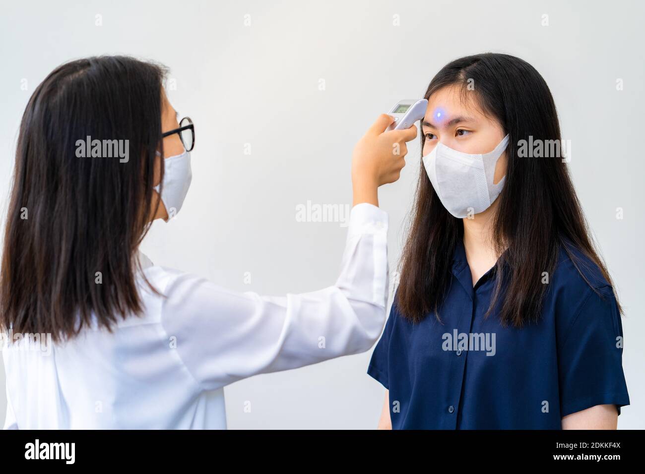 Asian body checking with doctor hi-res stock photography and images - Alamy