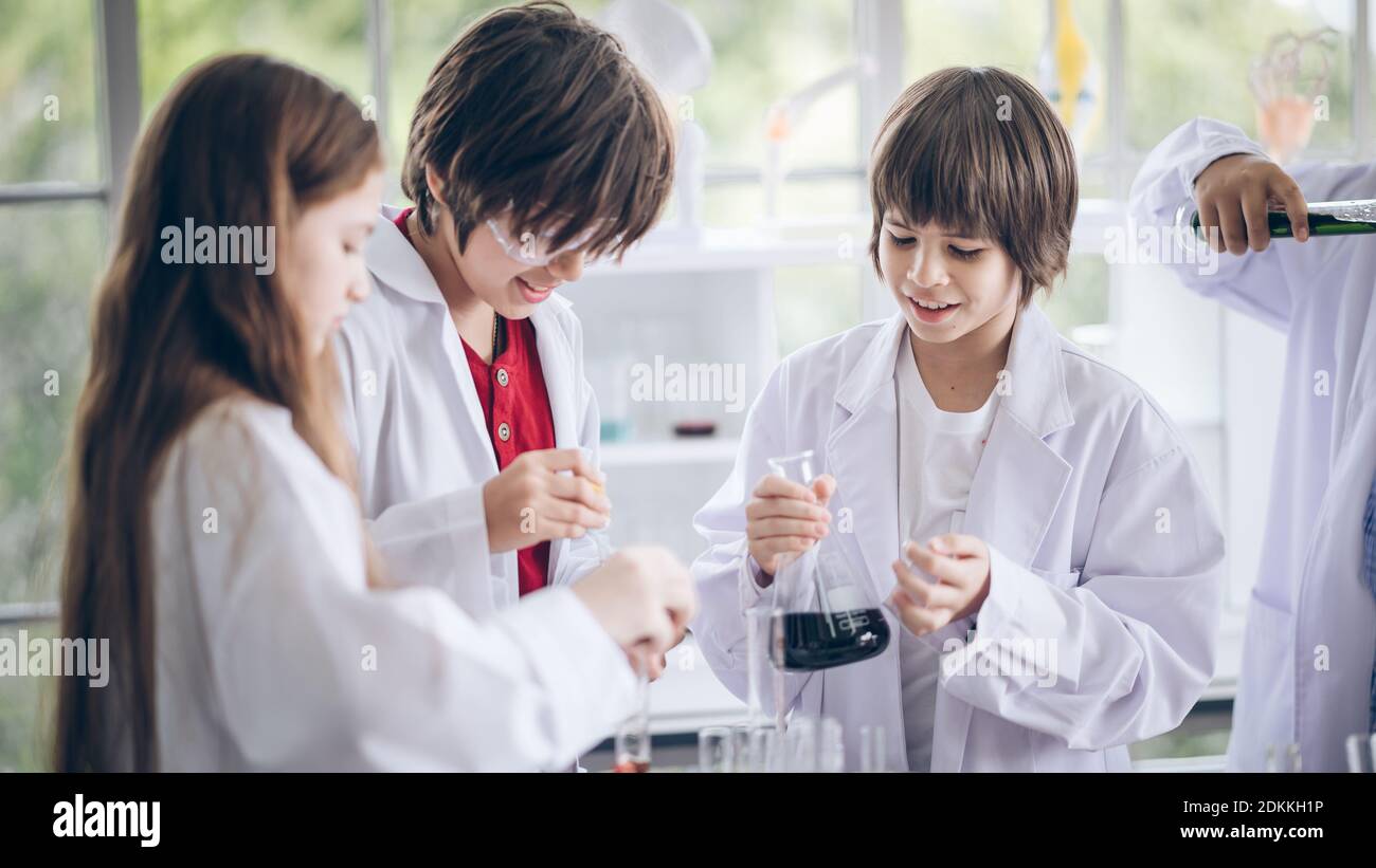 School students mixing liquid in hi-res stock photography and images ...