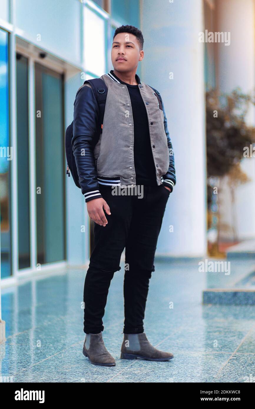 Full Length Of Man Standing On Tiled Floor Stock Photo - Alamy