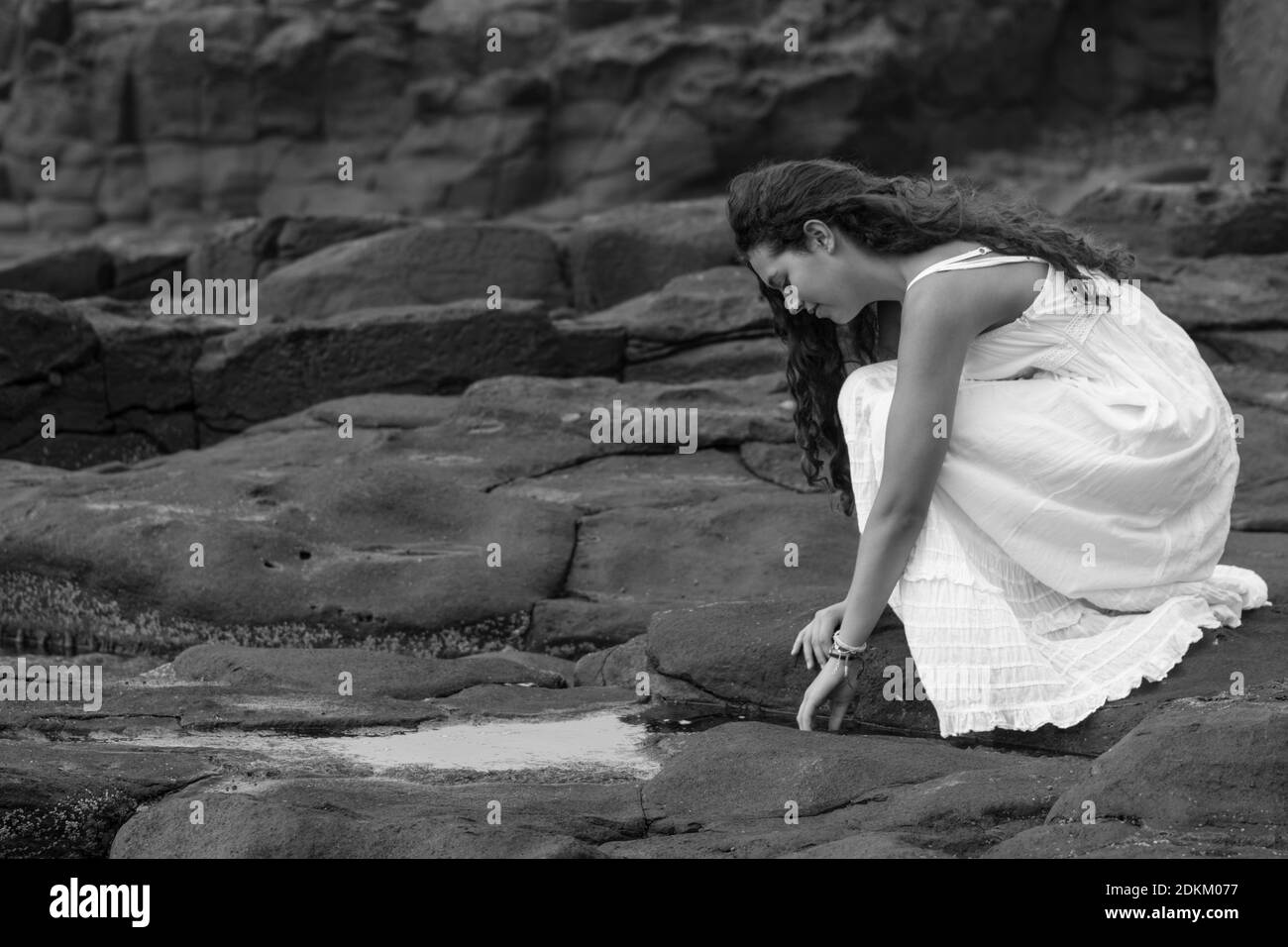 Side View Woman Crouching On Black and White Stock Photos & Images - Alamy