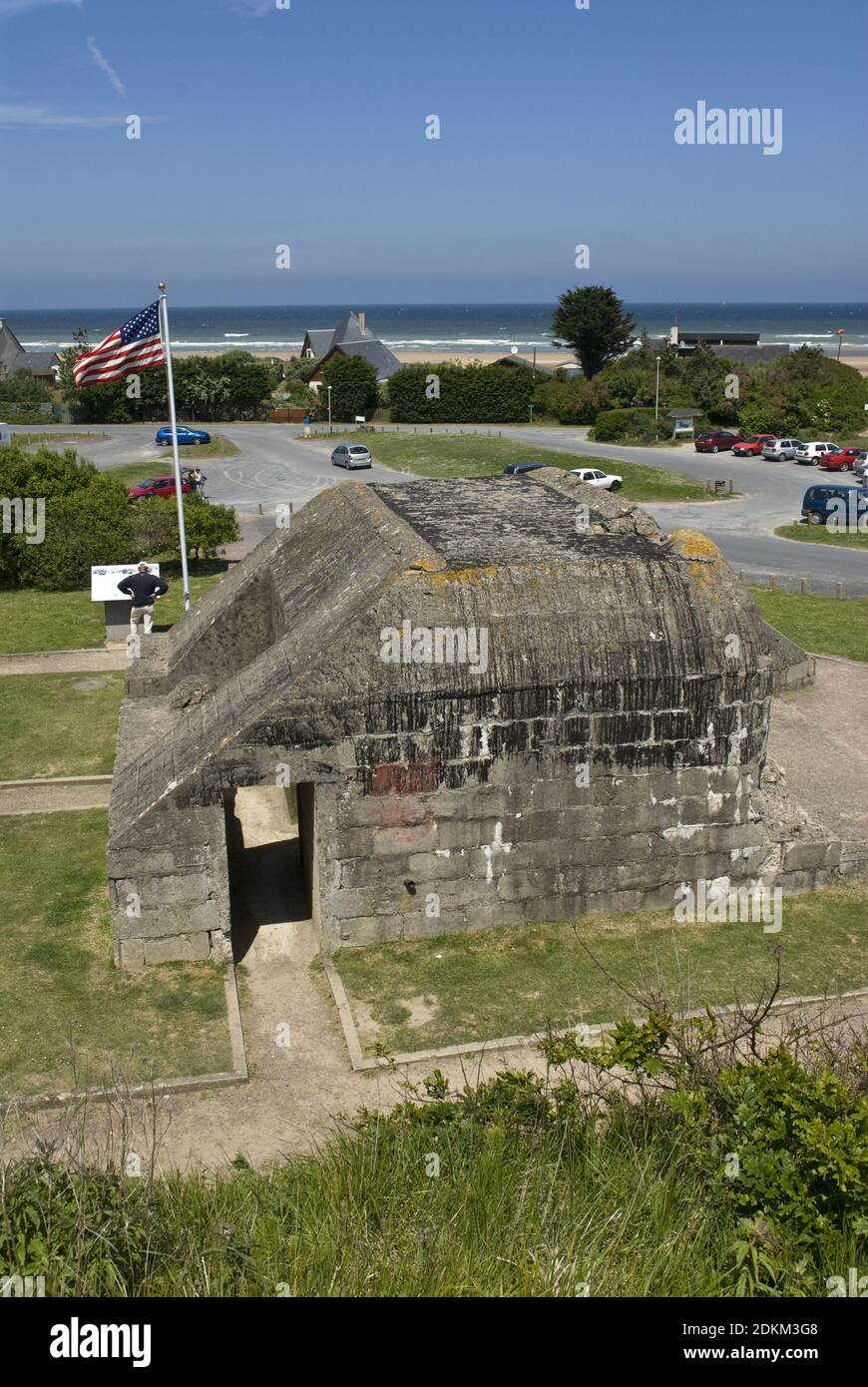 Tourists view remnants of a concrete German gun battery used during the ...