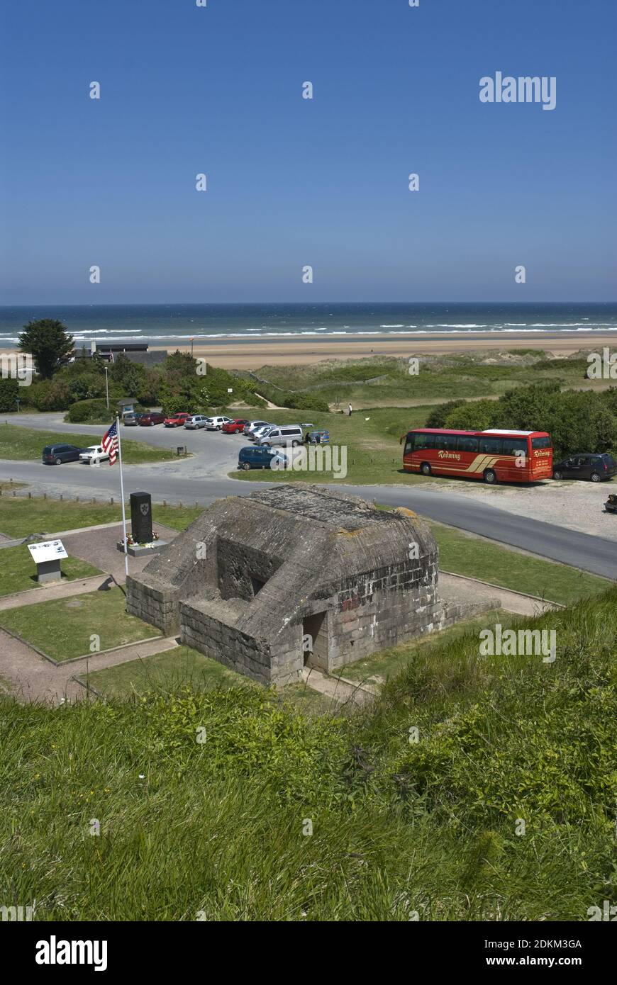 Tourists view remnants of a concrete German gun battery used during the ...