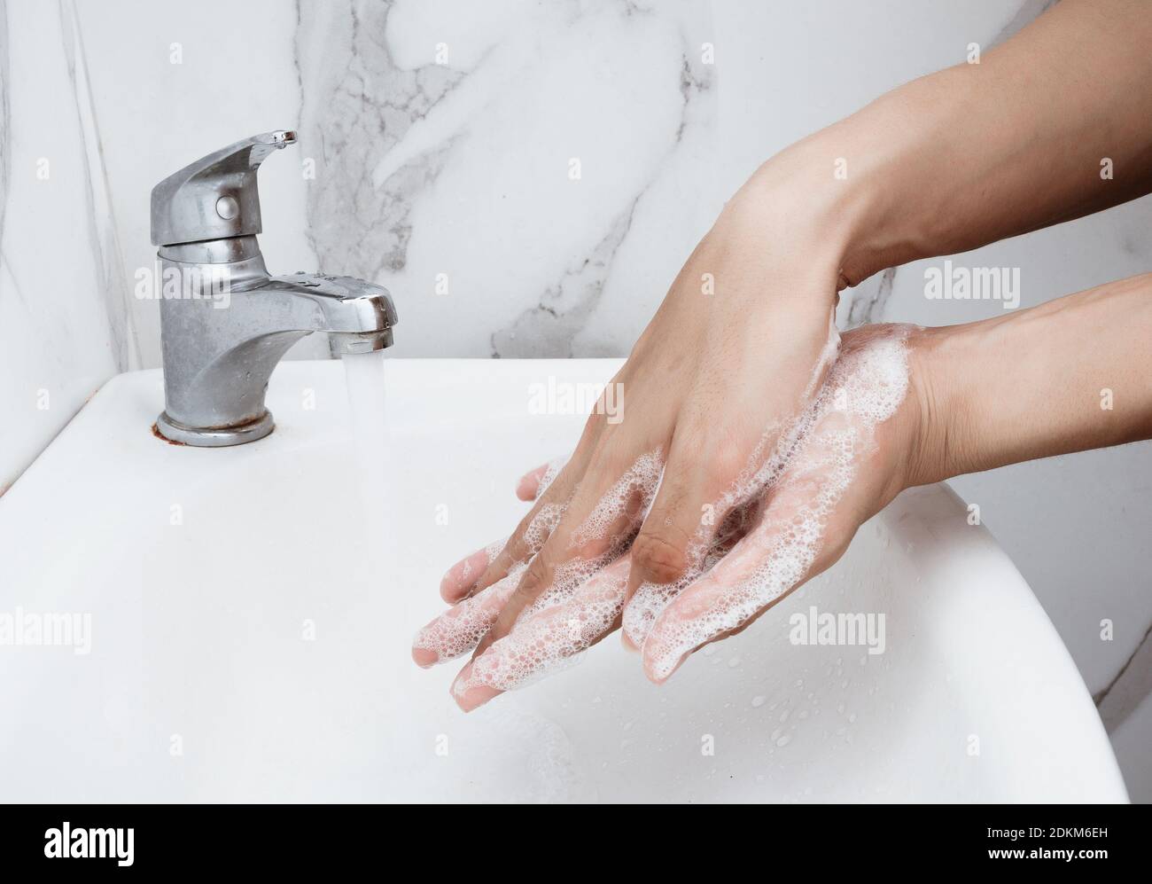Women hand washing in stream hi-res stock photography and images - Alamy