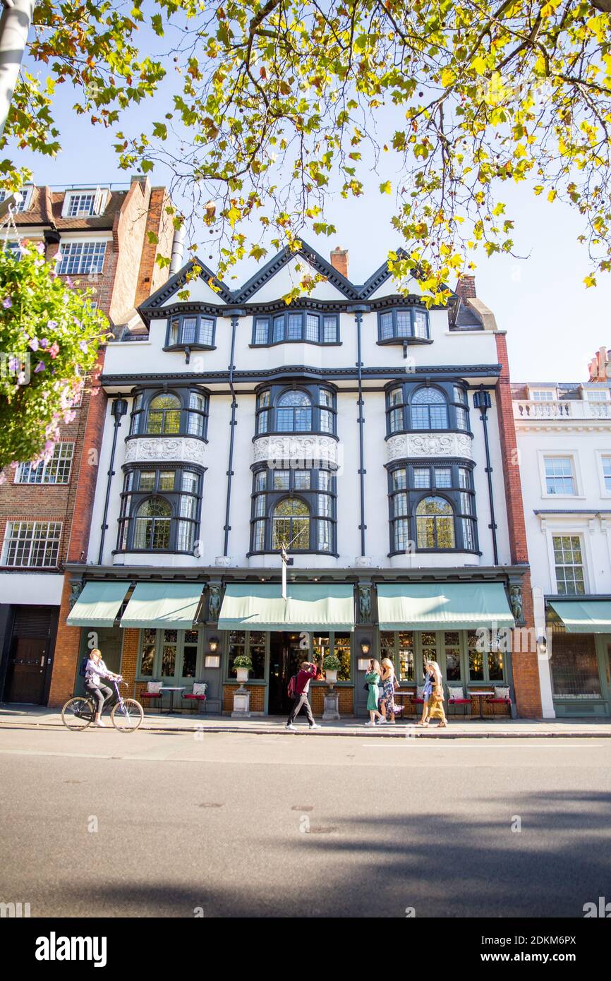 British restaurant building with people outside passing by Stock Photo ...
