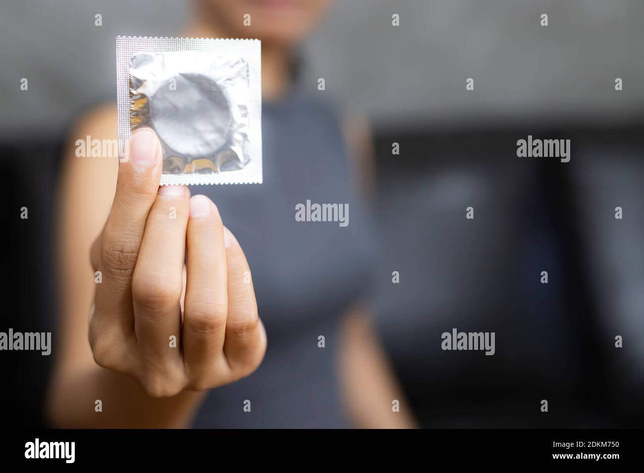 Female hand holding condom hi-res stock photography and images - Alamy