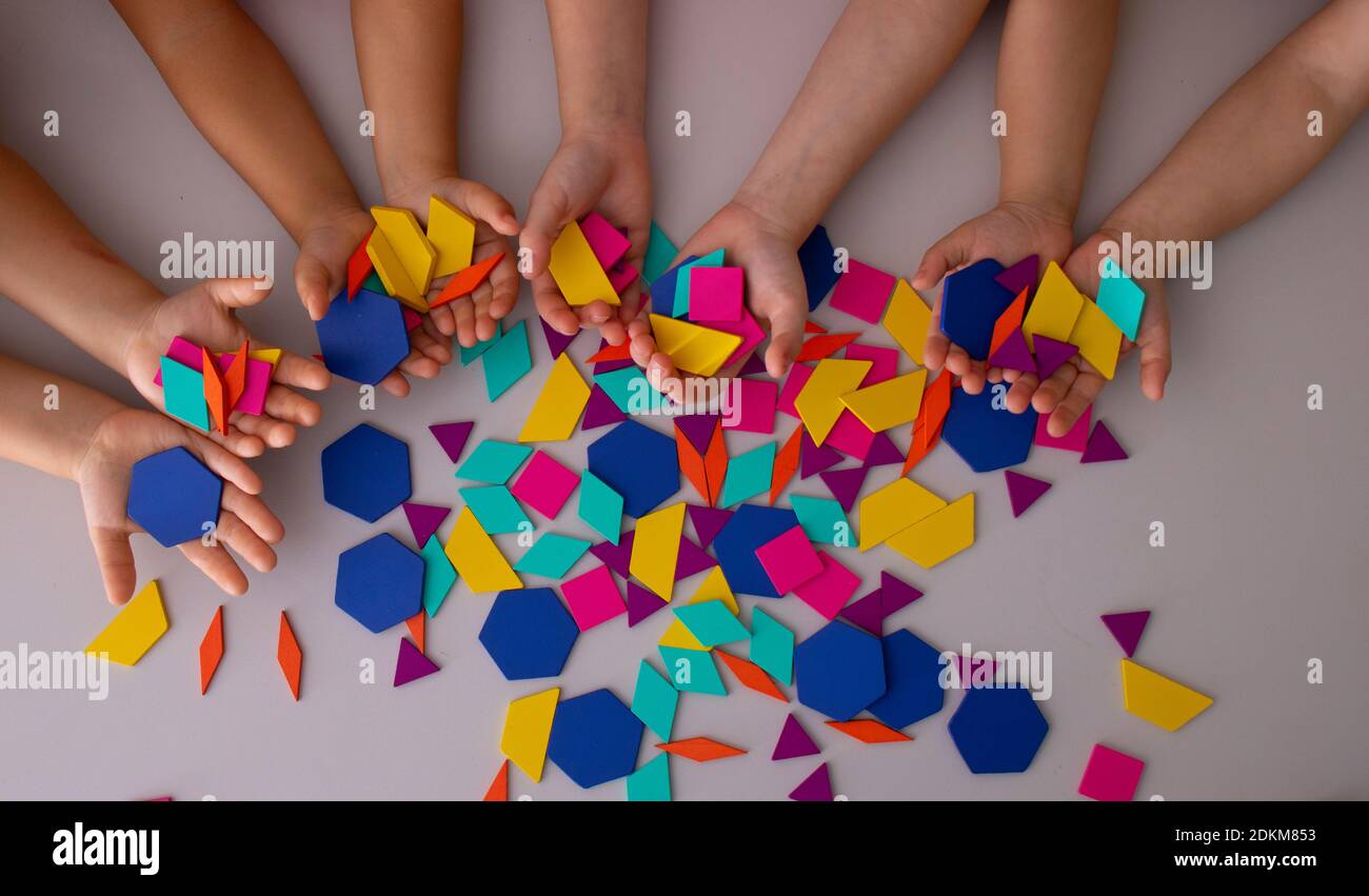 childrens hands doing cubes at preschool class Stock Photo - Alamy