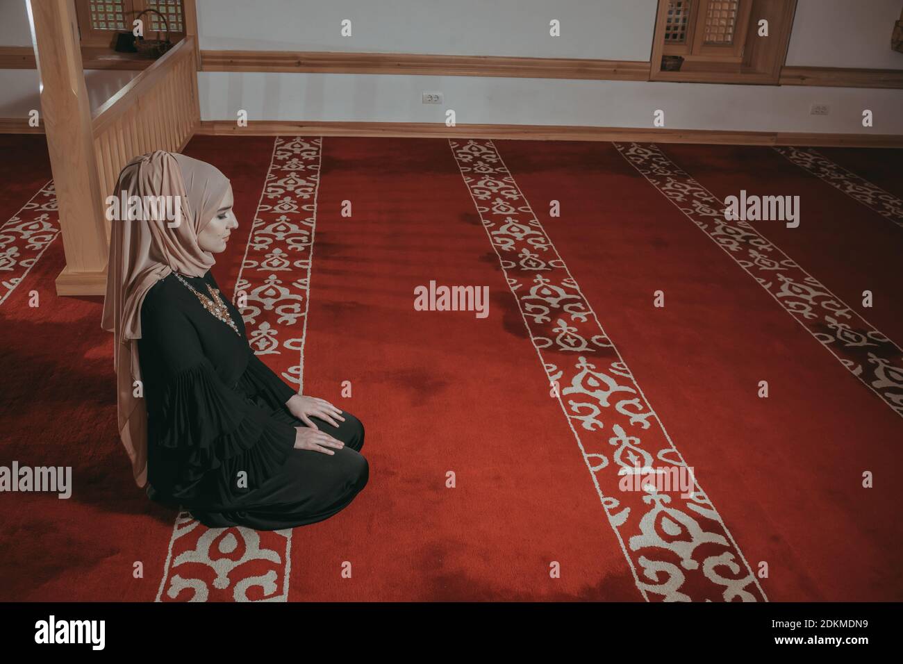 High Angle View Of Woman Praying While Kneeling On Carpet Stock Photo ...