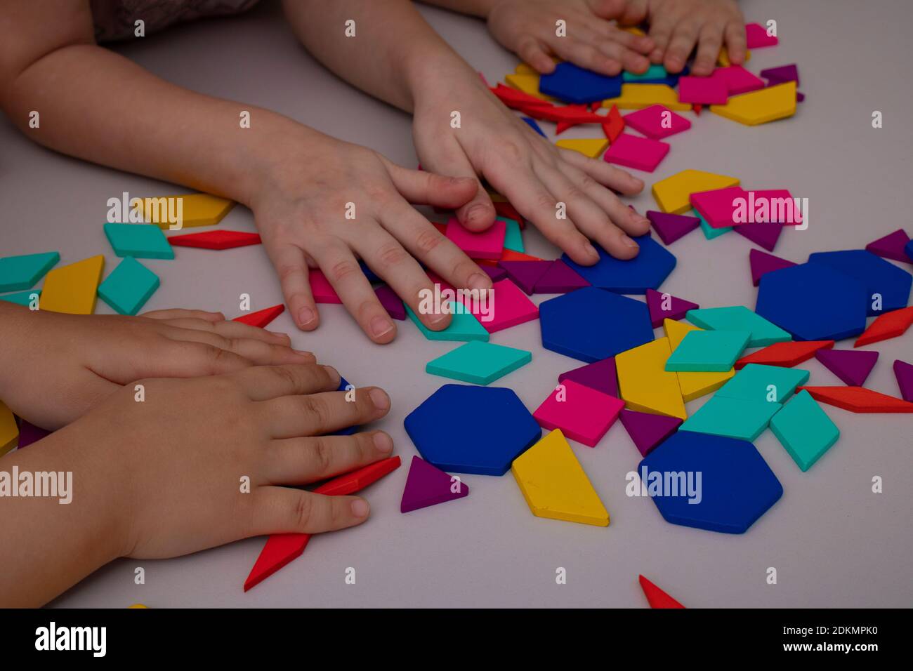 Kids learning how to build wooden blocks Stock Photo - Alamy