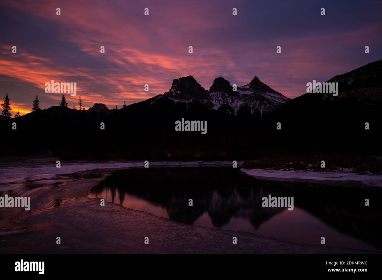 Three Sisters mountain peaks in Canmore Alberta before sunrise Stock ...