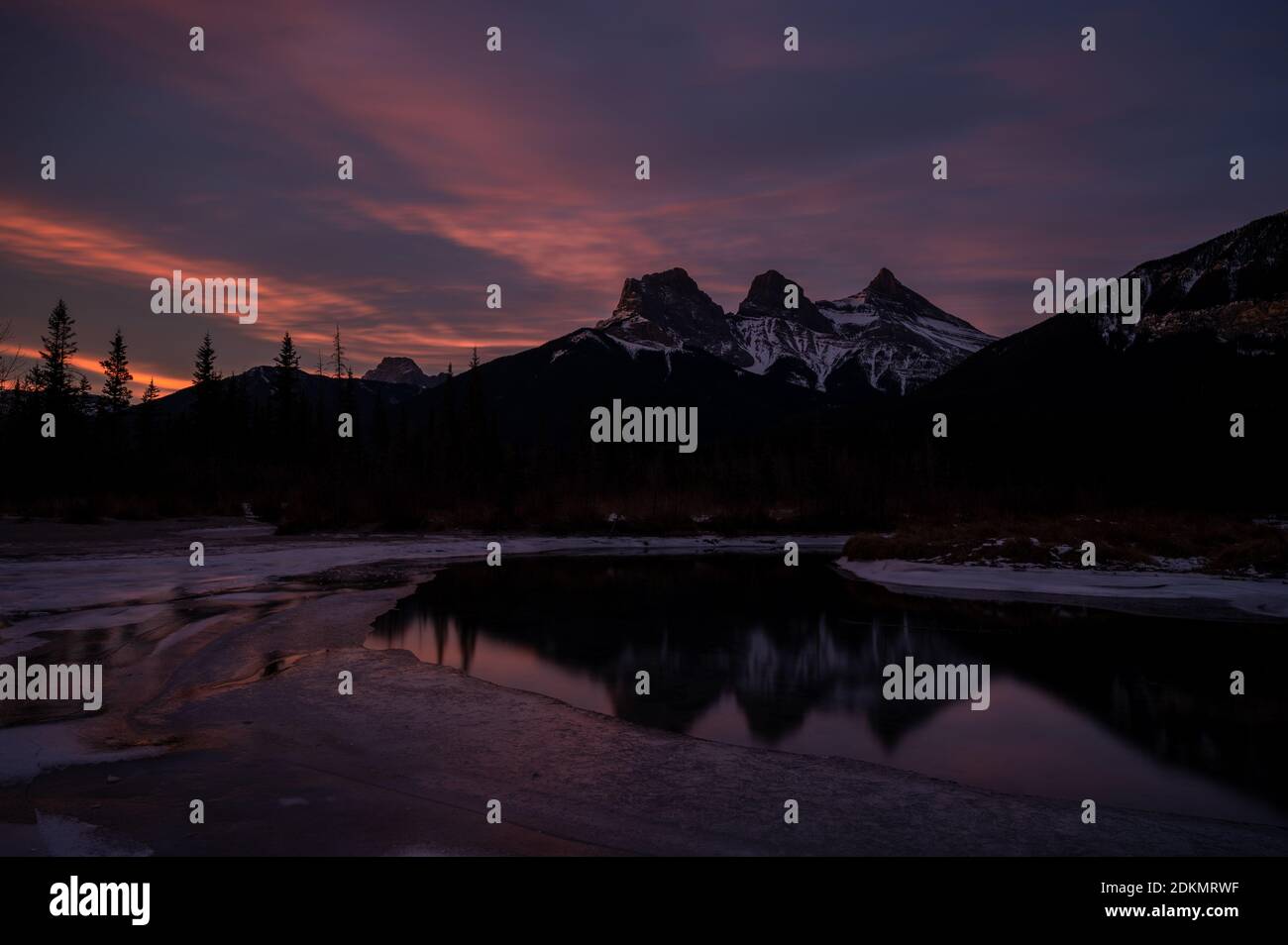 Three Sisters mountain peaks in Canmore Alberta before sunrise Stock ...