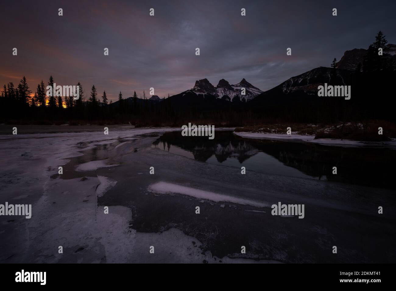Three Sisters mountain peaks in Canmore Alberta before sunrise Stock ...