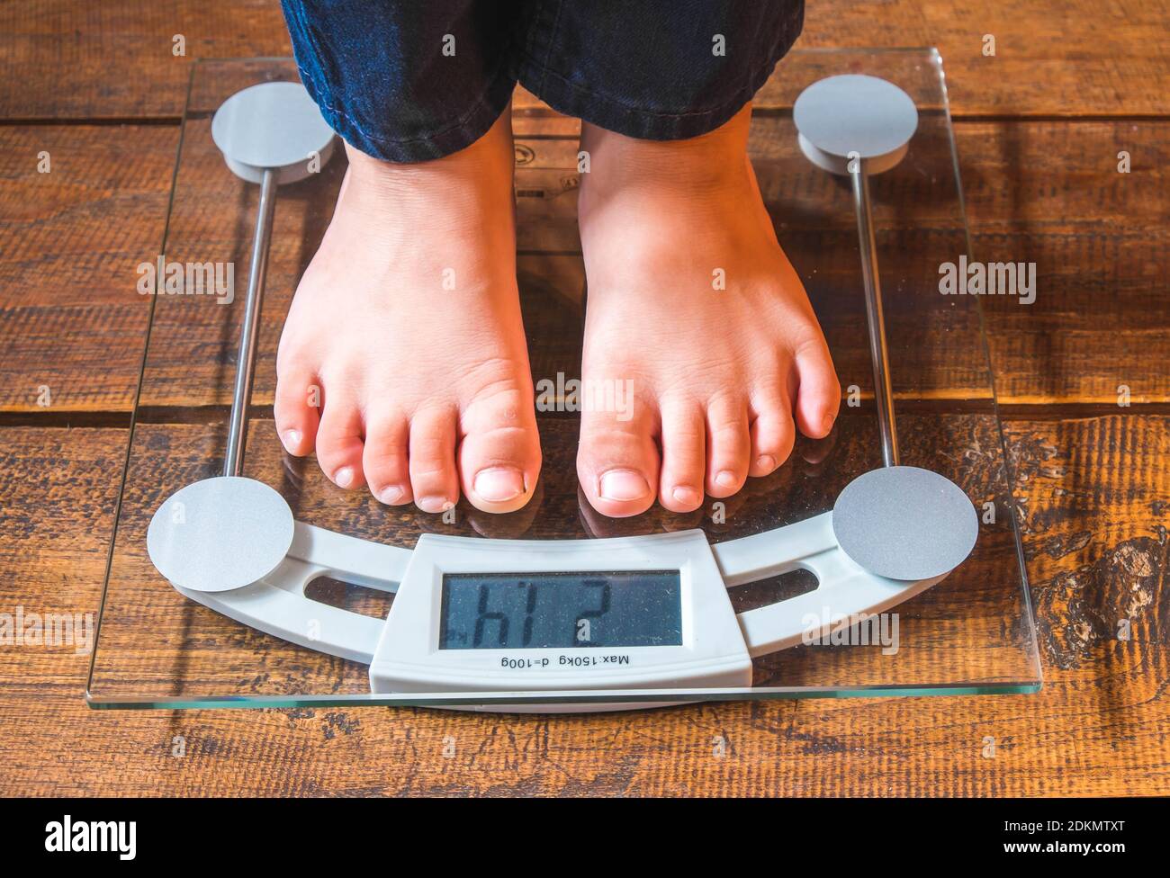 Person standing on scale jeans hi-res stock photography and images - Alamy