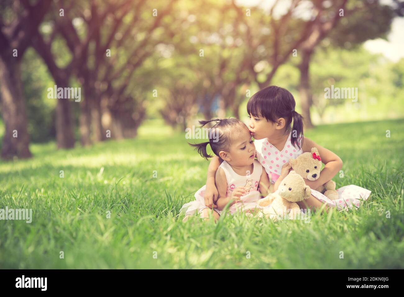 Two Young Sisters Kissing High Resolution Stock Photography and Images - Alamy