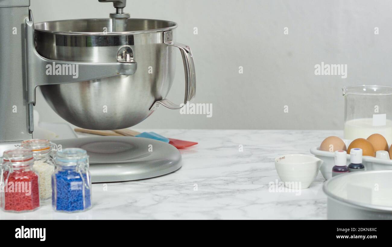 Step by step. Mixing ingredients in standing kitchen mixer to bake a ...