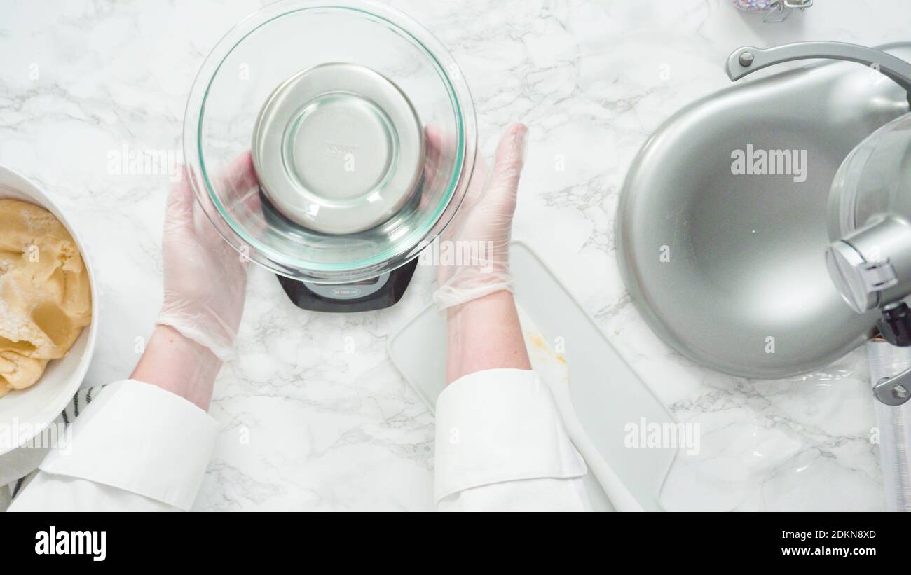 Step by step. Flat lay. Measuring cookie dought with a digital kitchen ...