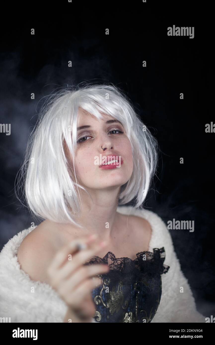 Female model smoking a cigarette Stock Photo - Alamy