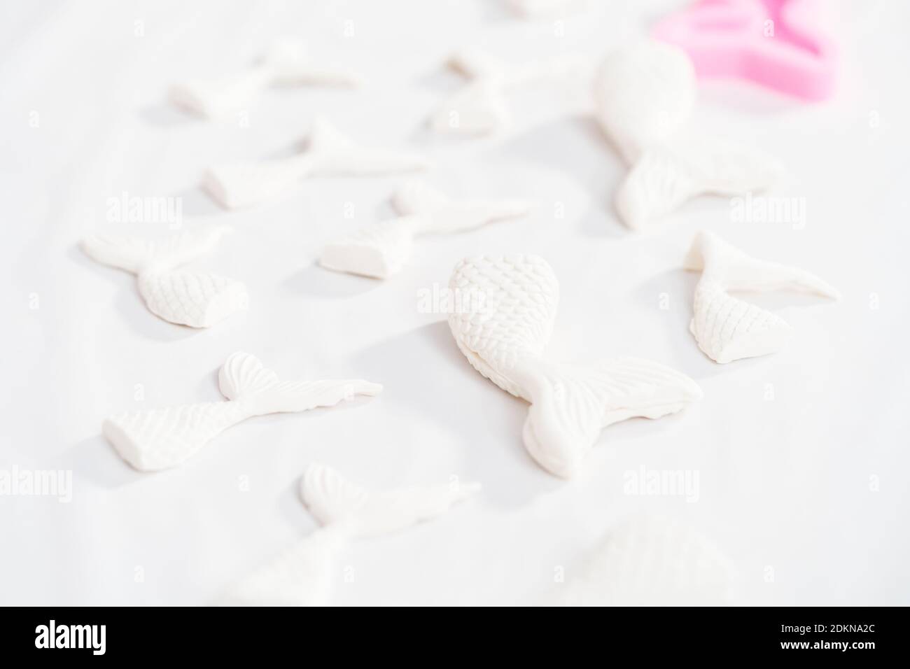 Modeling mermaid tails with white air-dry modeling clay Stock Photo - Alamy
