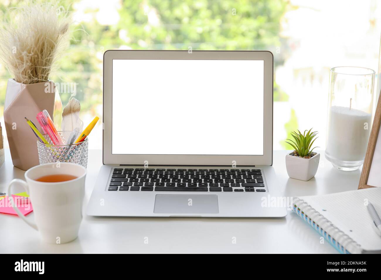 Interior of modern workplace with laptop Stock Photo - Alamy