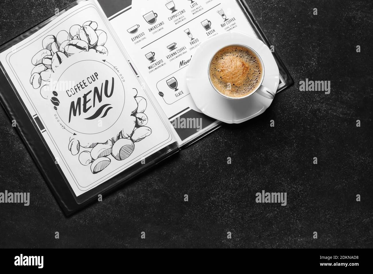 Cup of hot coffee and menu on table in cafe Stock Photo - Alamy