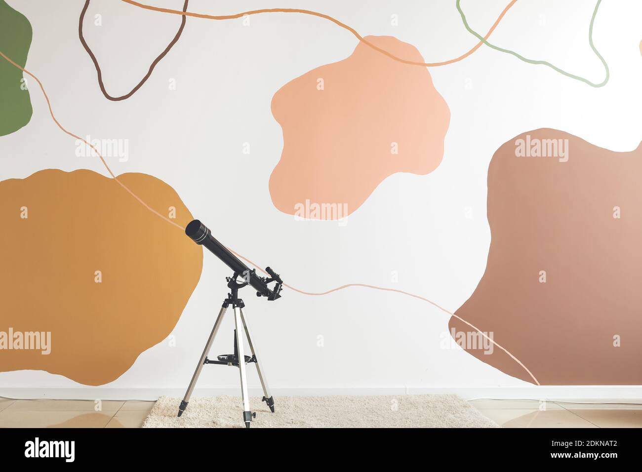 Interior of stylish room with modern telescope Stock Photo - Alamy