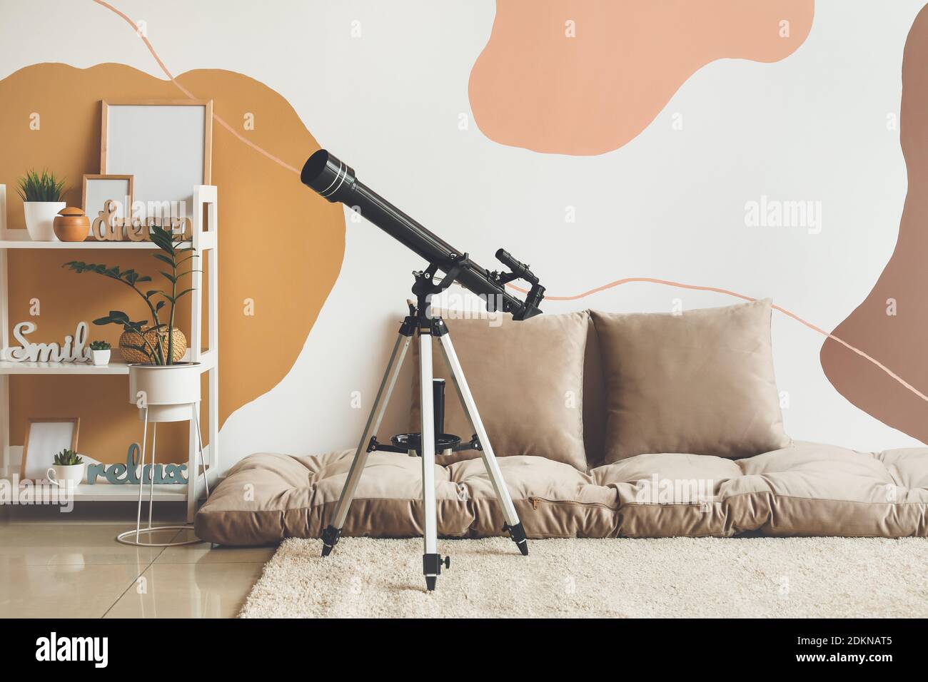 Interior of stylish room with modern telescope Stock Photo - Alamy