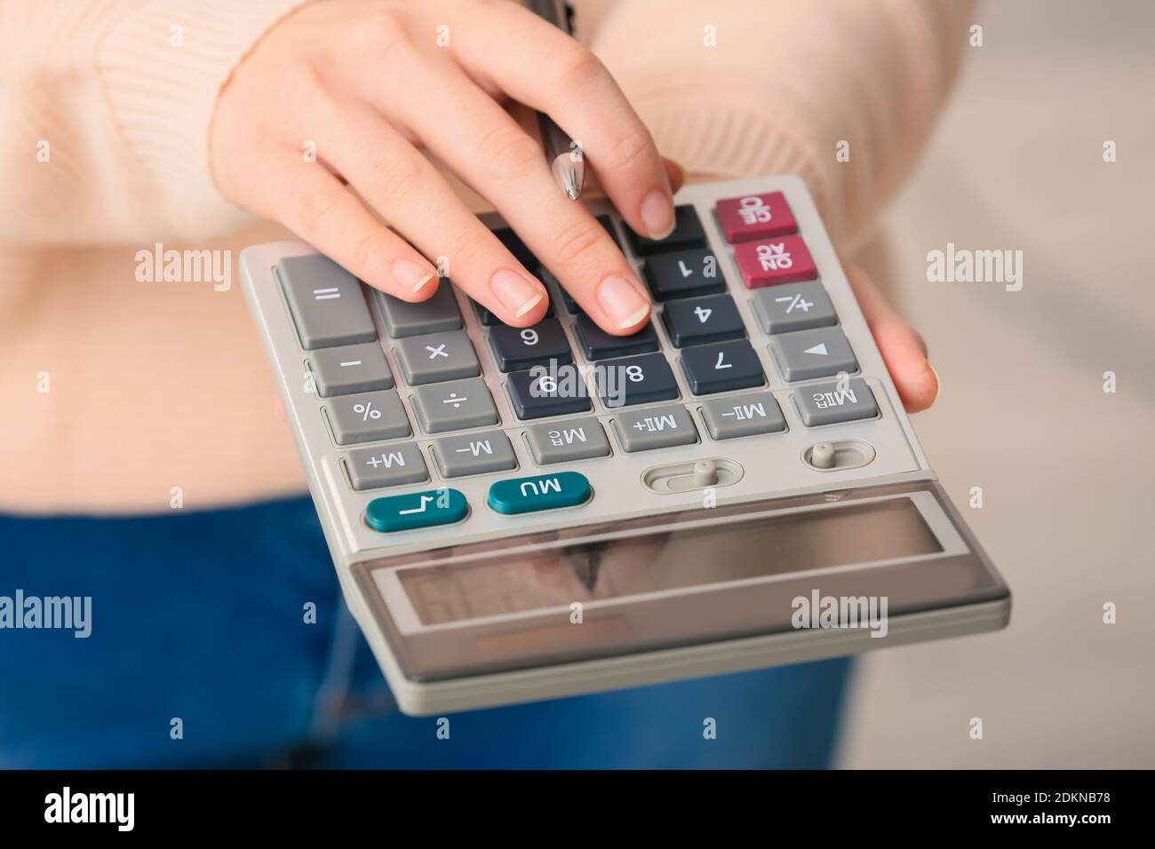 Female accountant with calculator in office, closeup Stock Photo - Alamy