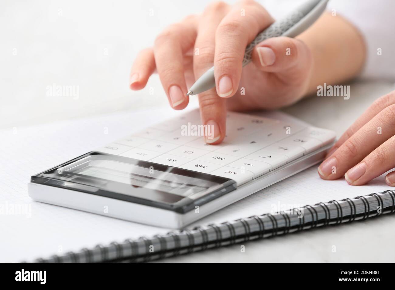 Female accountant with calculator working in office, closeup Stock ...
