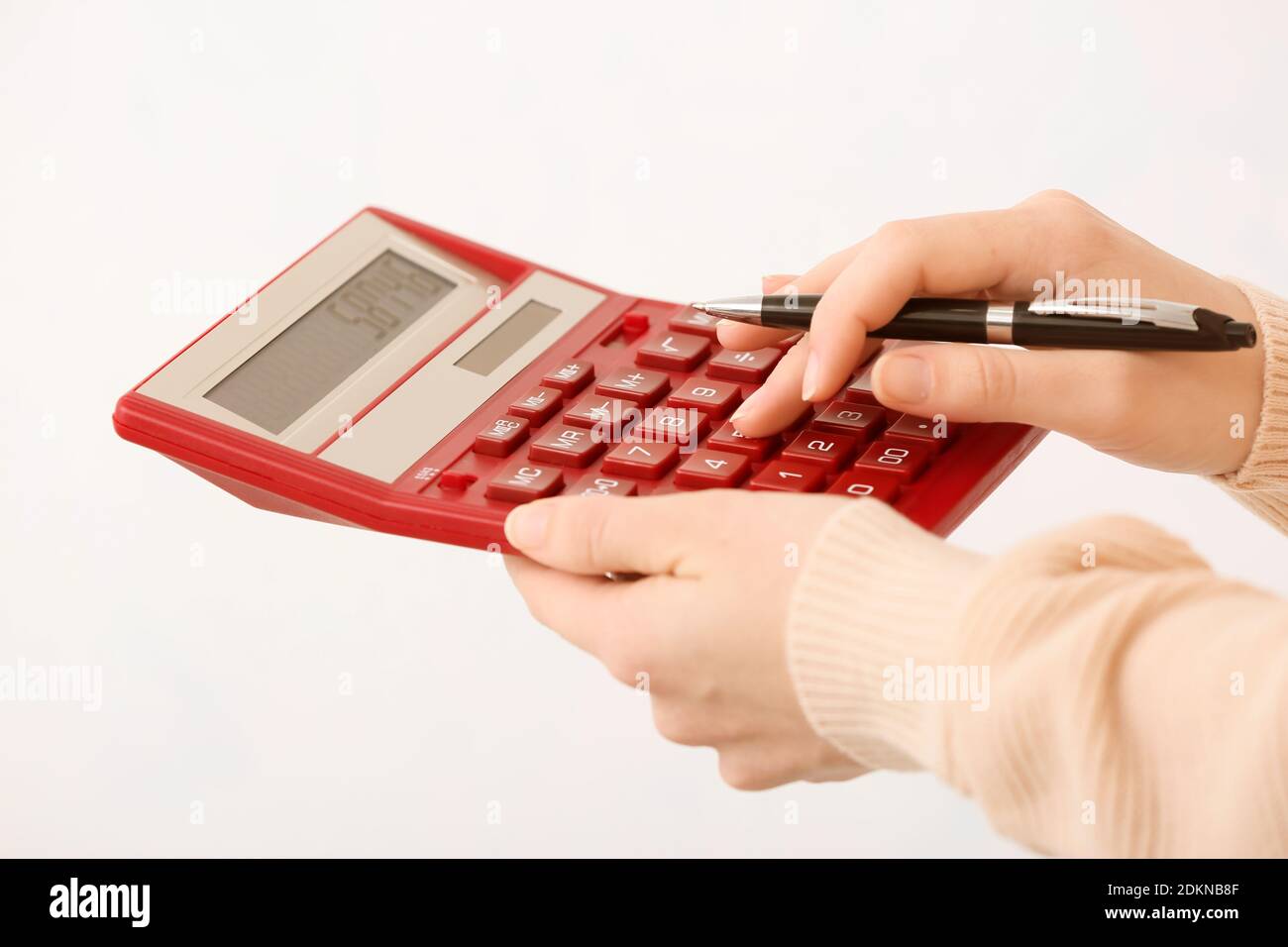 Female accountant with calculator on white background Stock Photo - Alamy