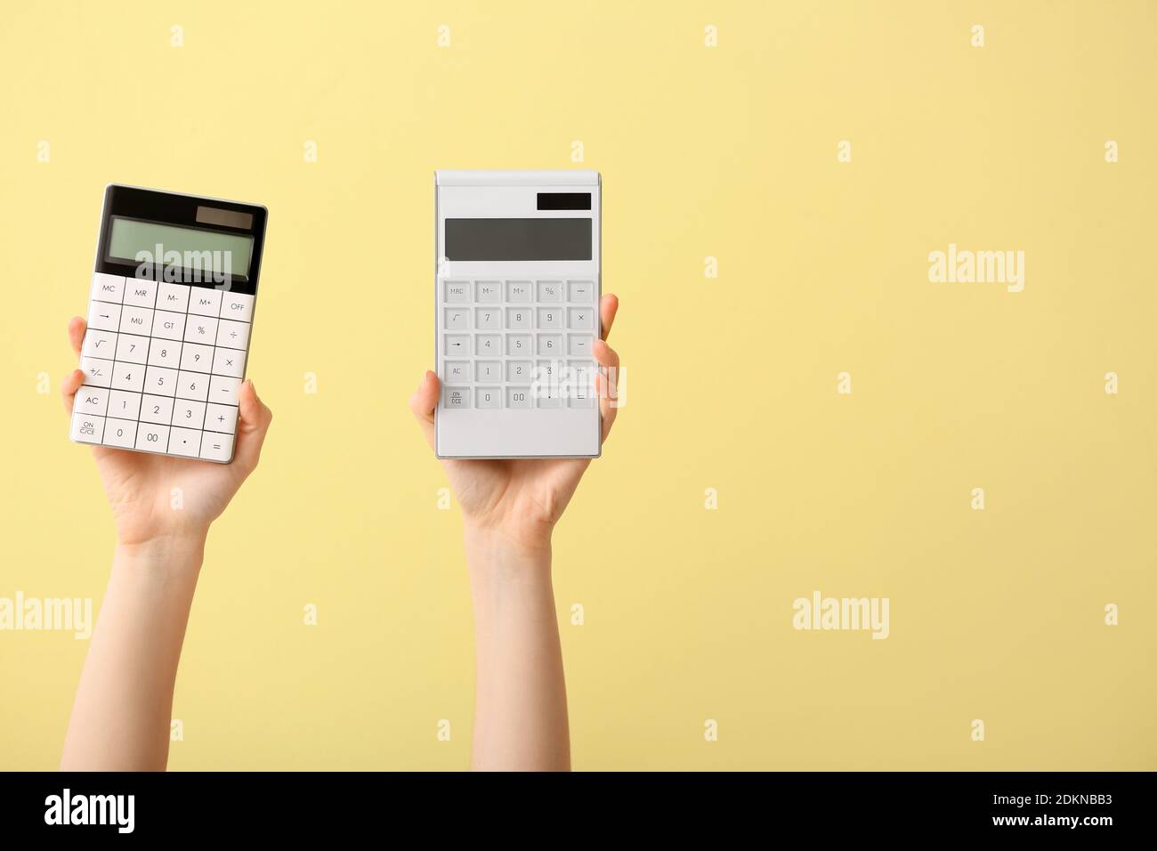 Hands and calculators on table hi-res stock photography and images - Alamy