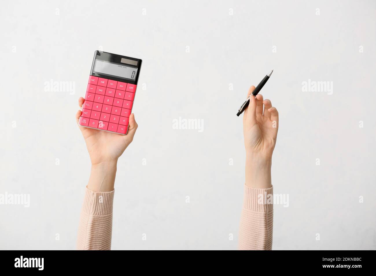 Female hands with calculator and pen on white background Stock Photo ...