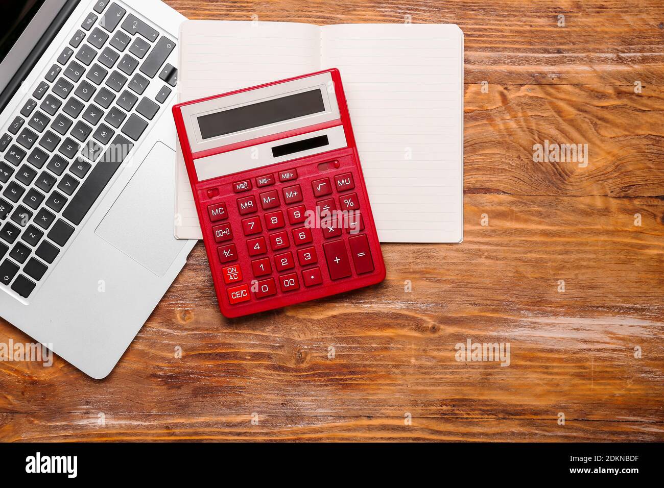 Modern calculator, laptop and notebook on wooden background Stock Photo ...