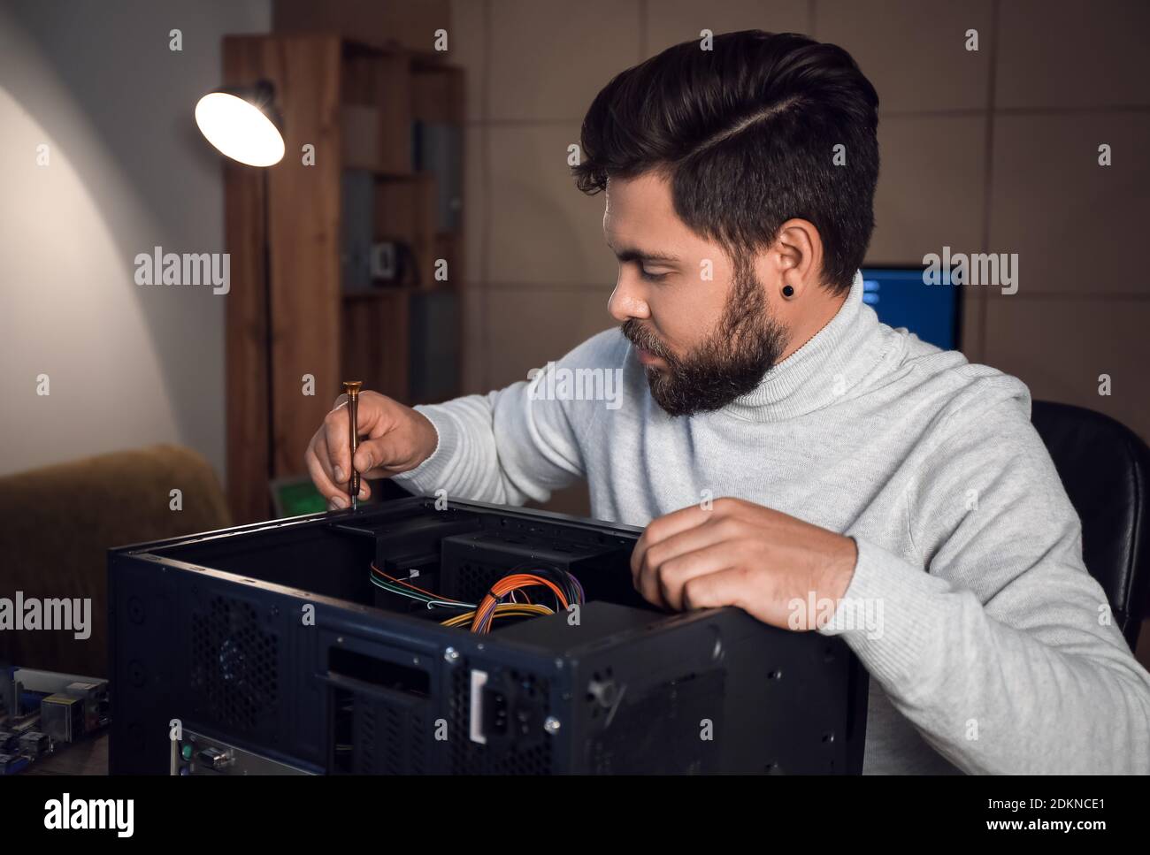 Technician repairing computer in service center Stock Photo - Alamy