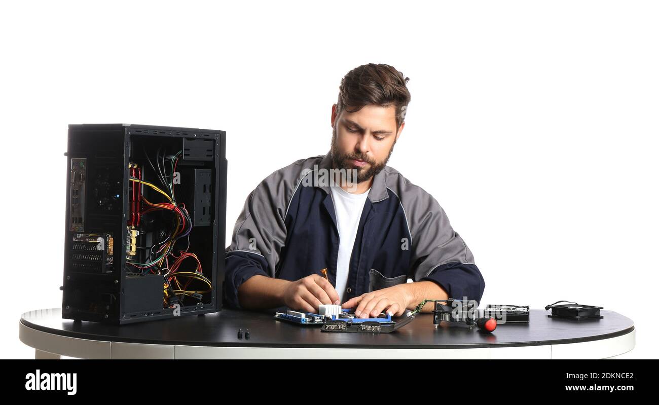 Technician repairing computer on white background Stock Photo - Alamy