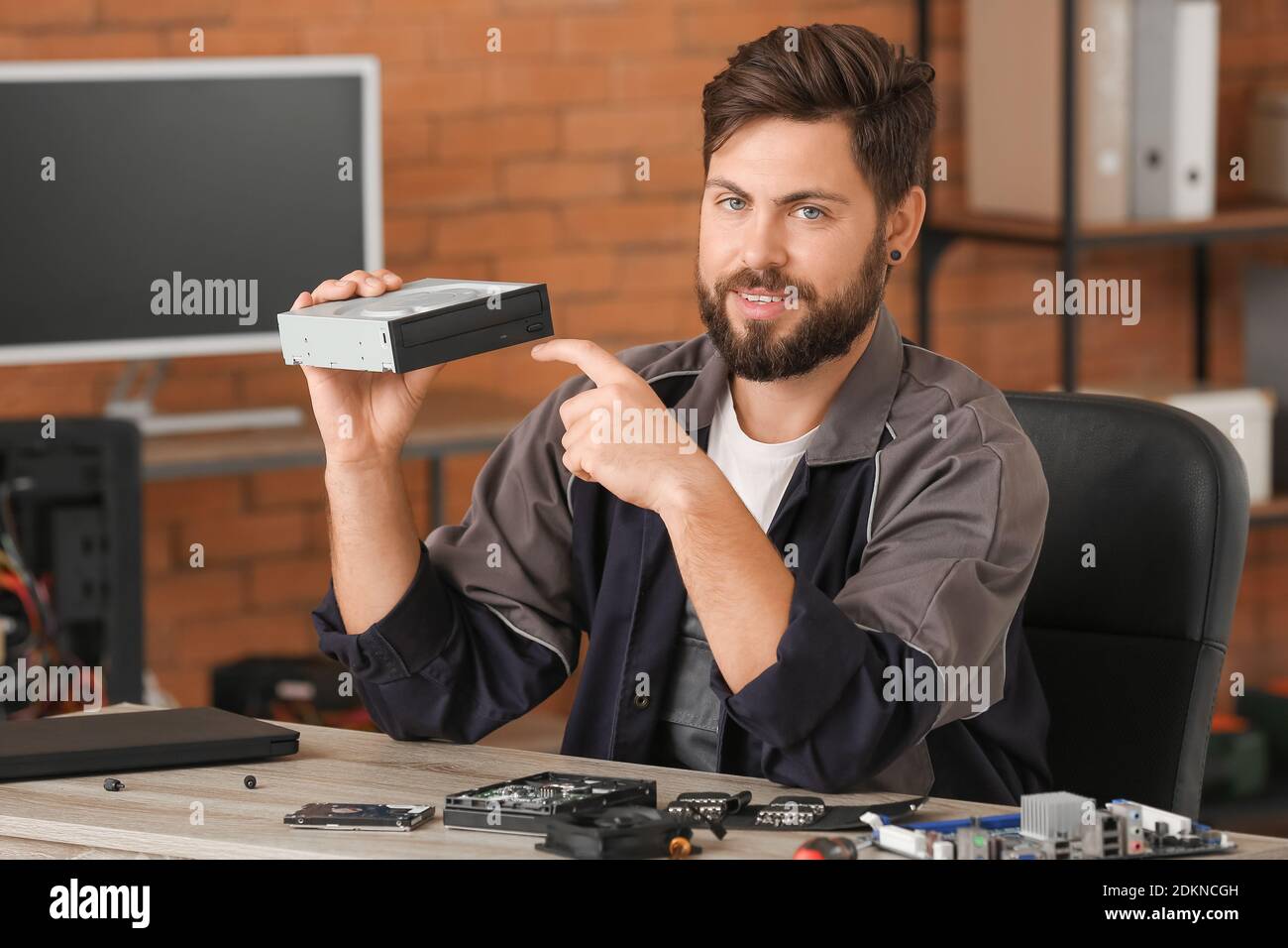 Technician repairing computer in service center Stock Photo - Alamy