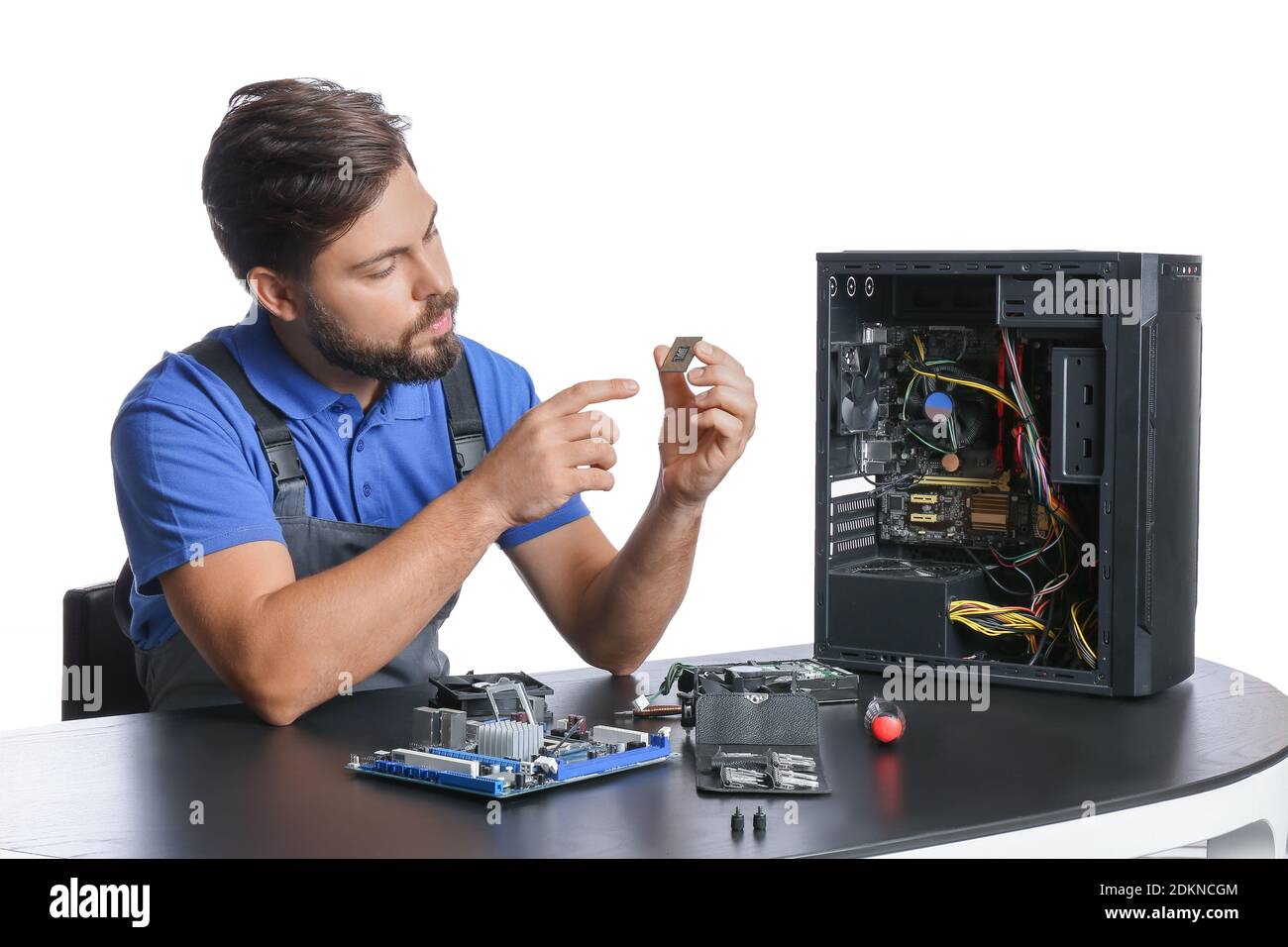 Technician repairing computer on white background Stock Photo - Alamy