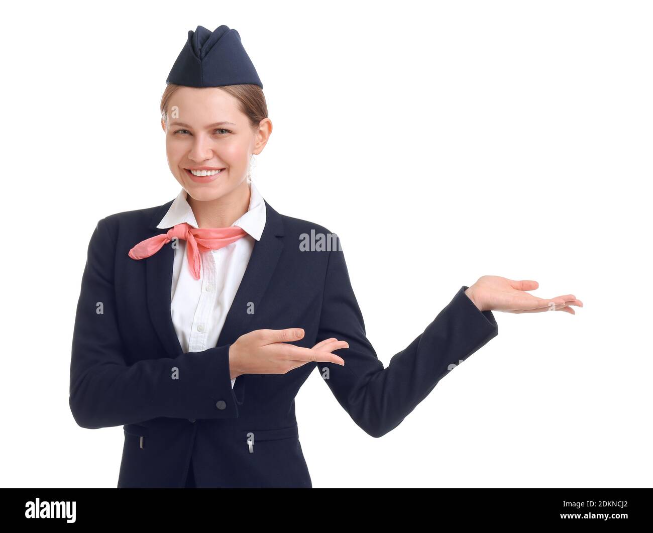Beautiful stewardess showing something on white background Stock Photo ...