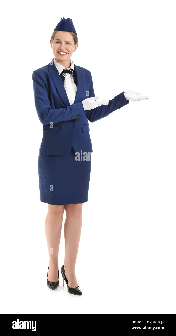 Beautiful stewardess showing something on white background Stock Photo ...