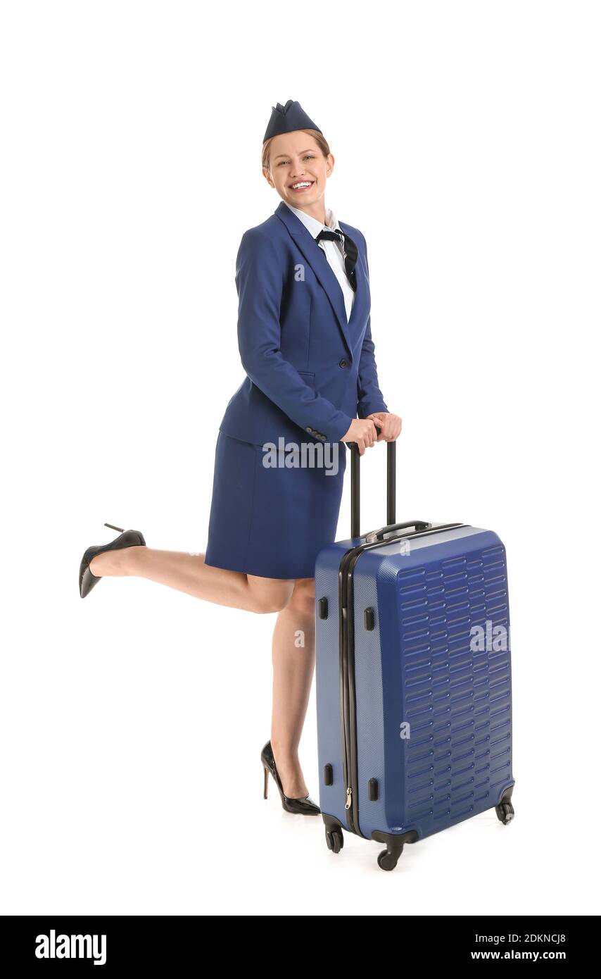 Beautiful stewardess with luggage on white background Stock Photo - Alamy