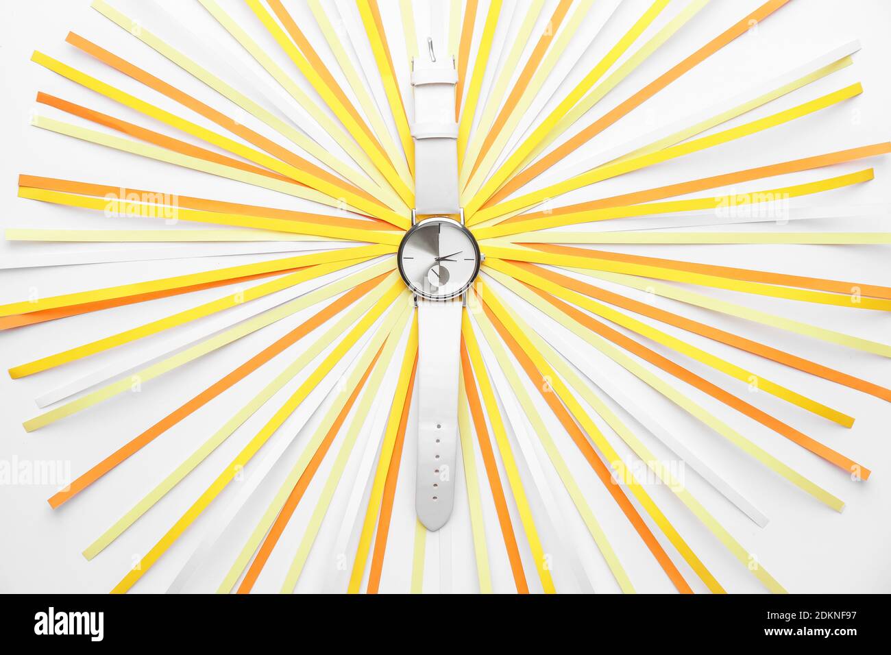 Wrist watch with paper strips on white background Stock Photo - Alamy