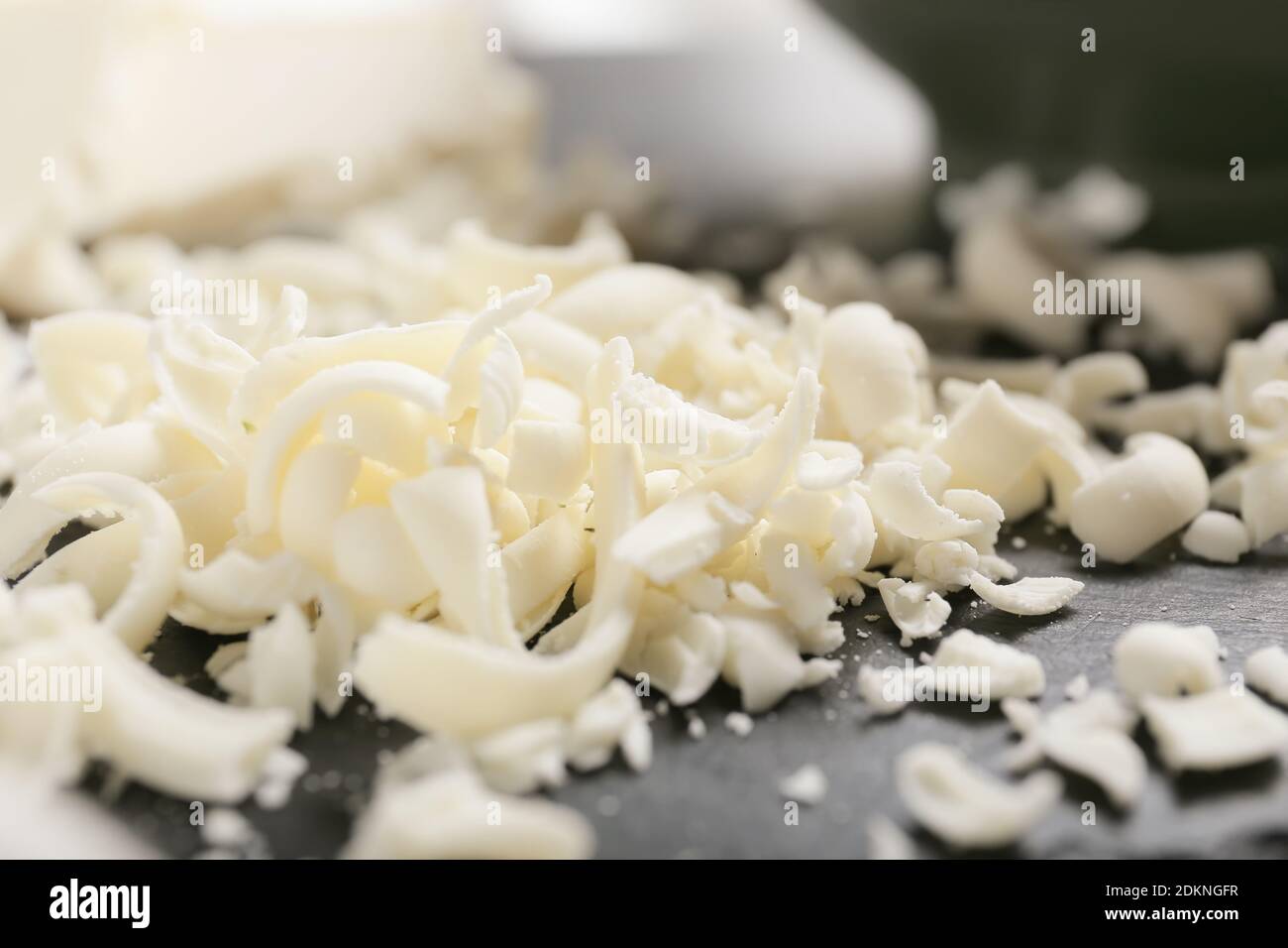 White chocolate shavings on table, closeup Stock Photo - Alamy