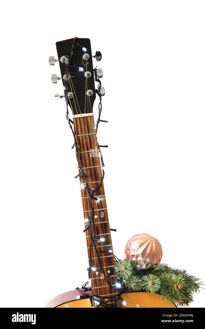 Guitar with Christmas lights and decor on white background Stock Photo ...