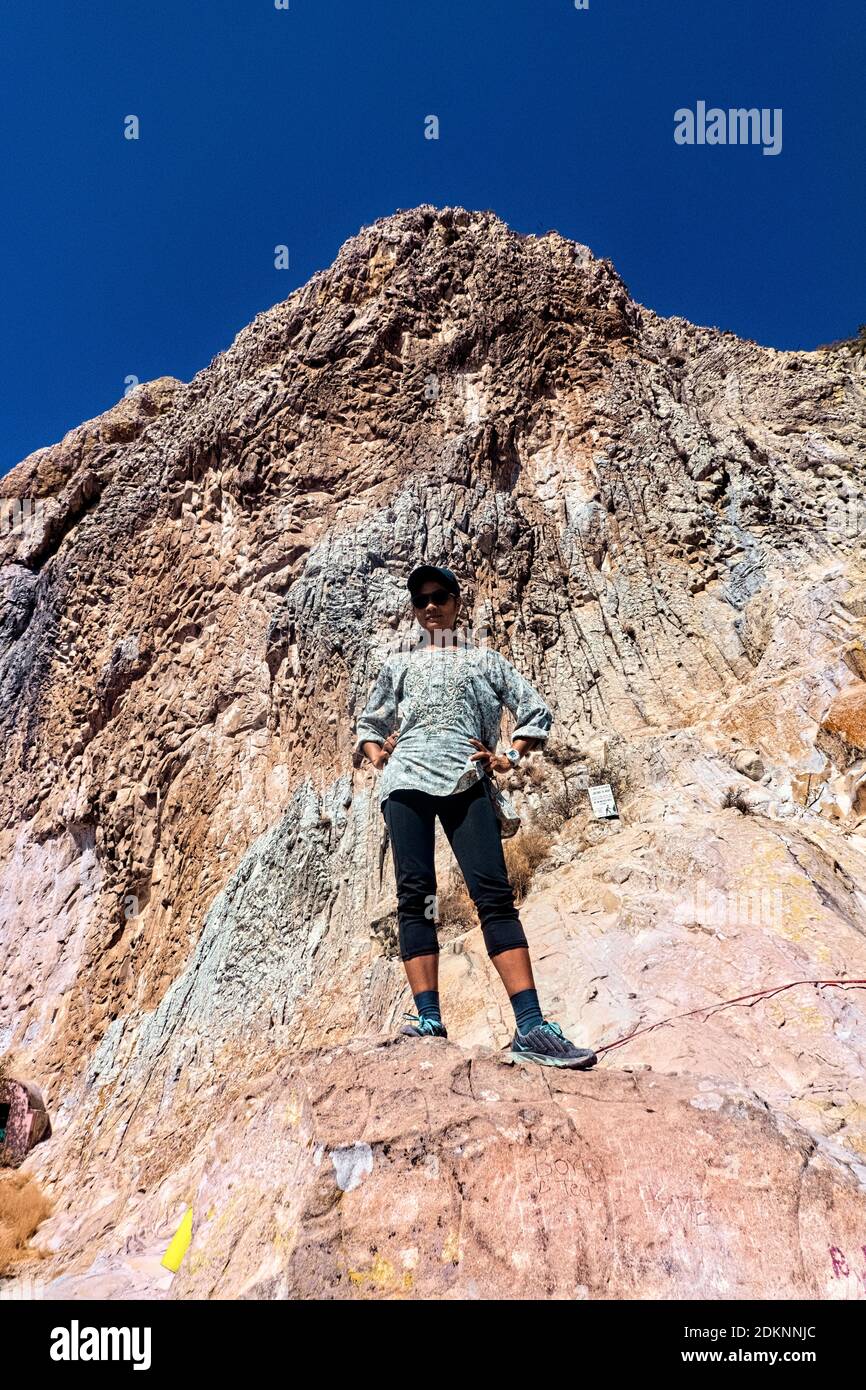 Standing under Peña de Bernal, UNESCO site and one of the world’s ...