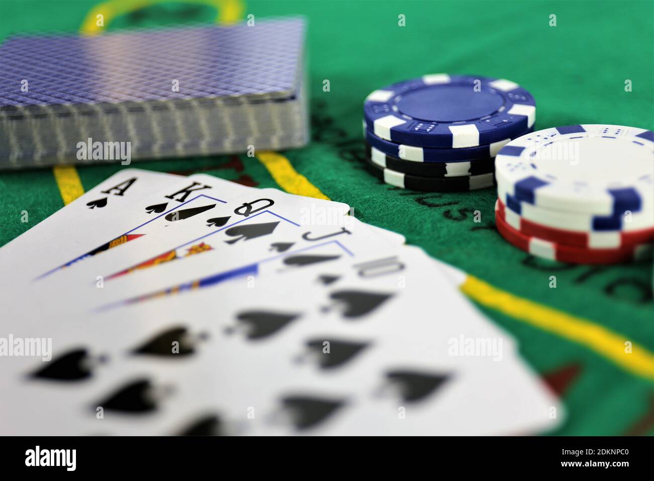An concept Image of some poker Cards on a green felt Stock Photo - Alamy