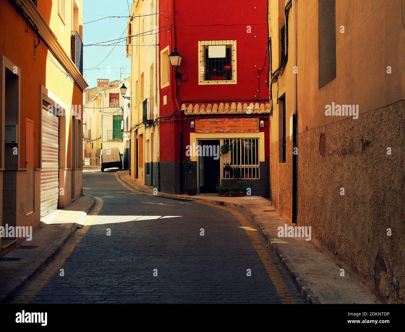 The colorful world of Spain. The facades of red and yellow buildings ...