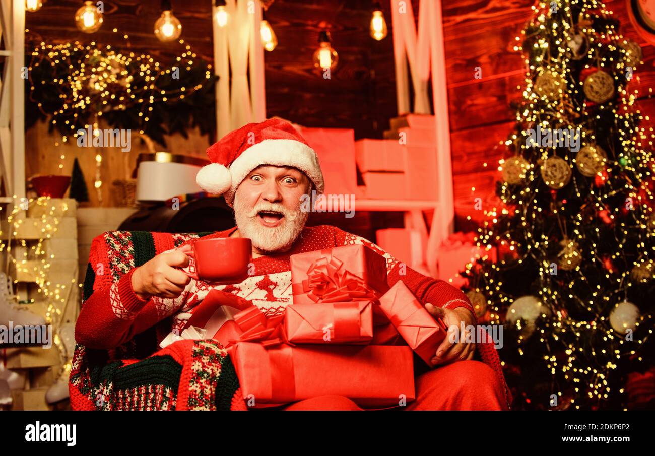 Delivering gifts. Winter vacation. Elderly grandpa at home. Traditions ...