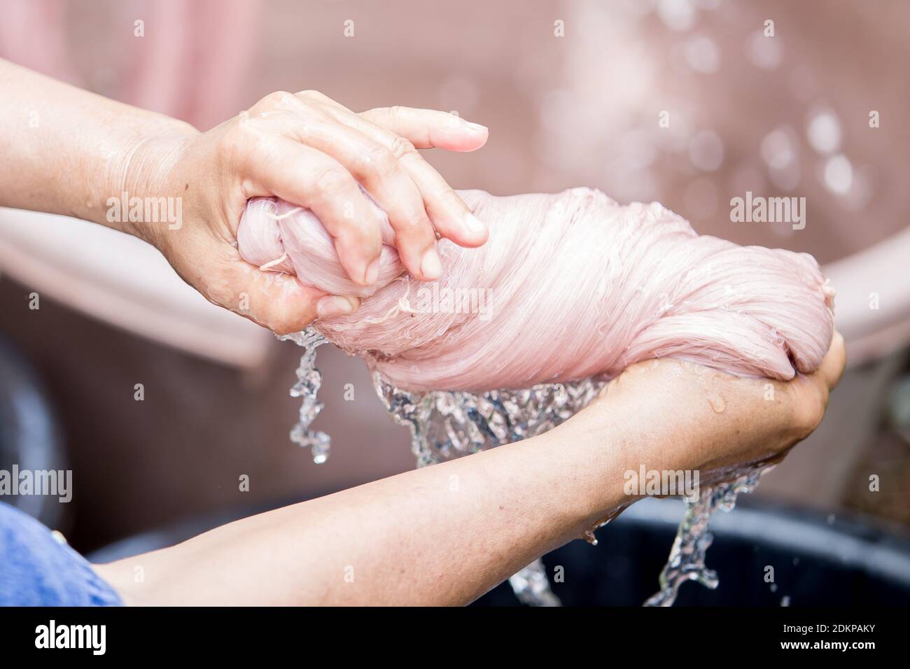 Squeezing cloth of water hi-res stock photography and images - Alamy
