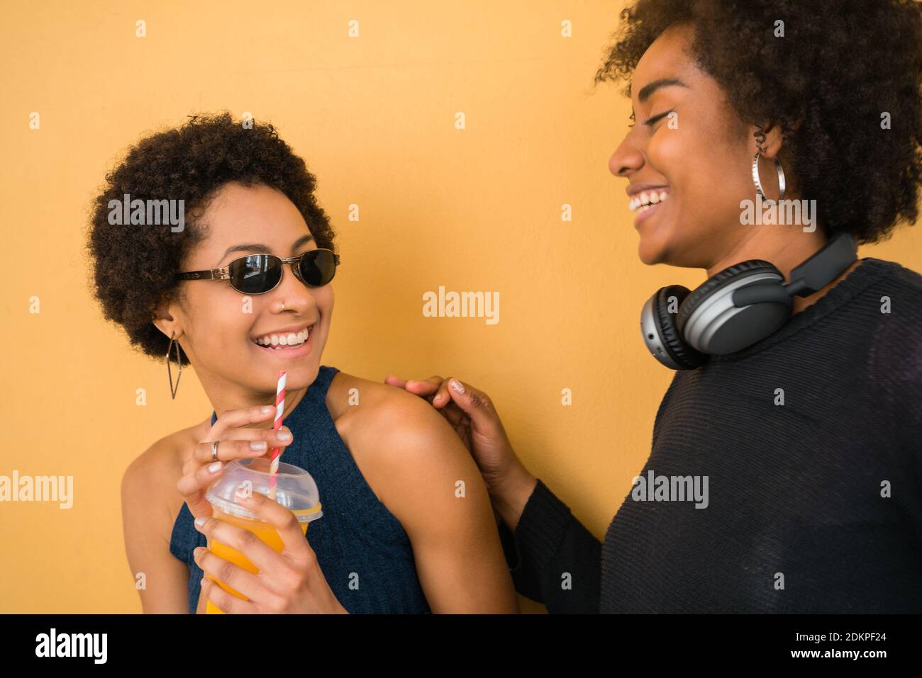 Two Afro friends having fun together Stock Photo - Alamy