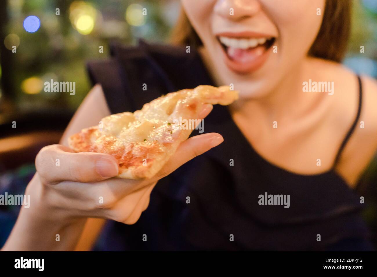 Indian woman eating pizza hi-res stock photography and images - Alamy