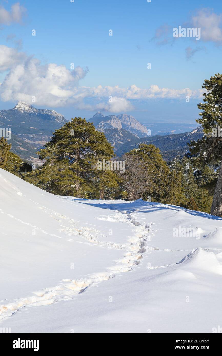 Winter Mountains landscape with snow covered peaks Against blue Sky in ...